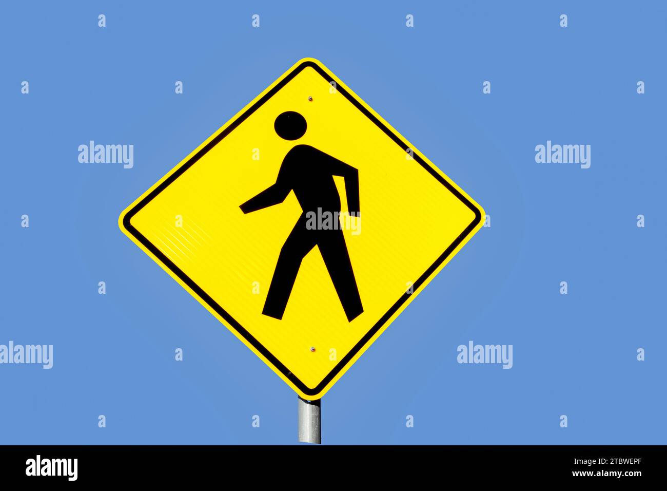 yellow pedestrian crossing or walking warning sign in Texas, USA Stock ...