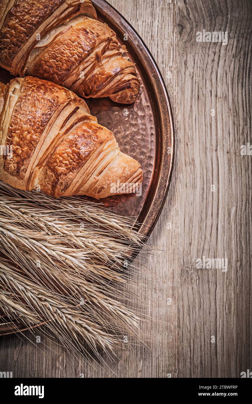 Golden wheat rye ears tasty croissants brass tray on wood board Stock Photo - Alamy