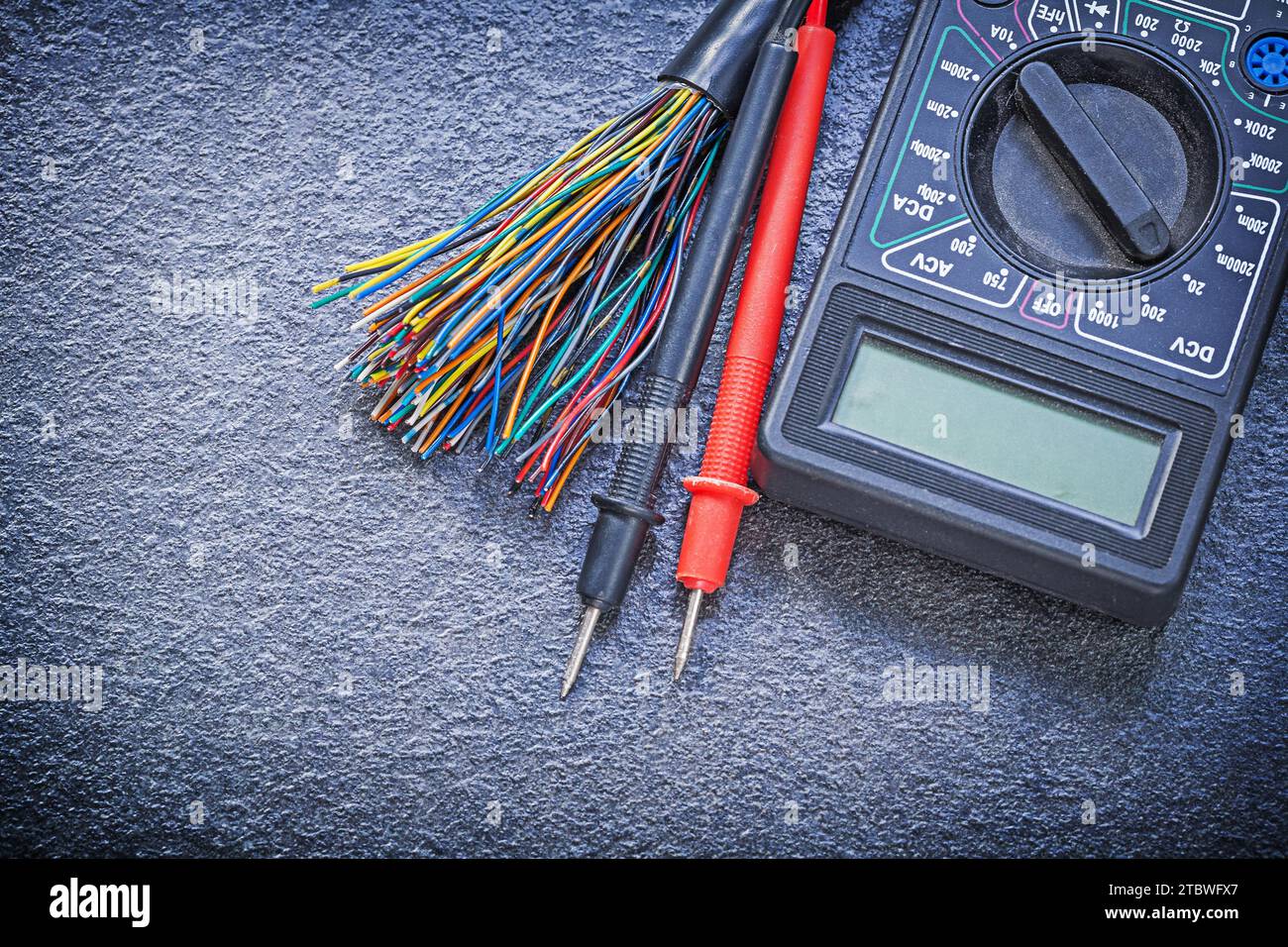 Digital multimeter electrical tester cables on black background ...