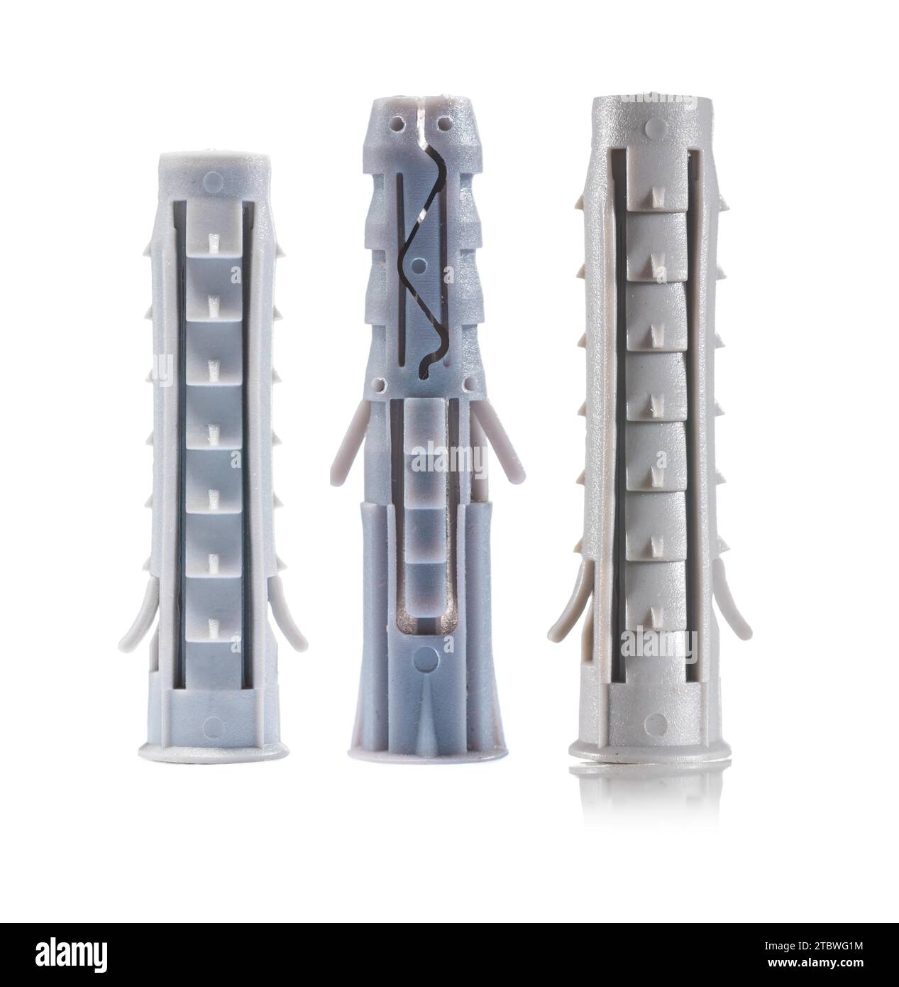 Three plastic wall anchors isolated Stock Photo - Alamy