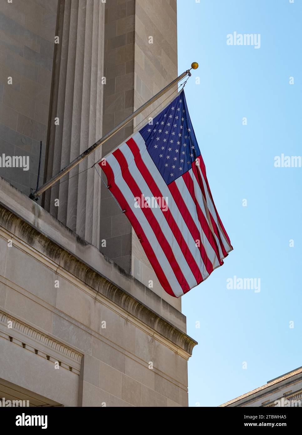A picture of an American flag hanging off a building, in Washington ...