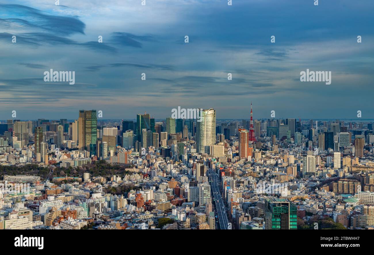 A picture of the Tokyo cityscape, showing the Tokyo Tower, at sunset ...