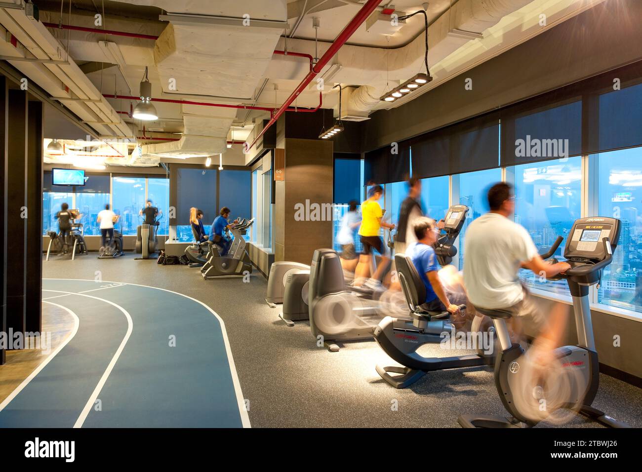 Bangkok, Thailand - March 23, 2010: Indoor gym and fitness center with ...