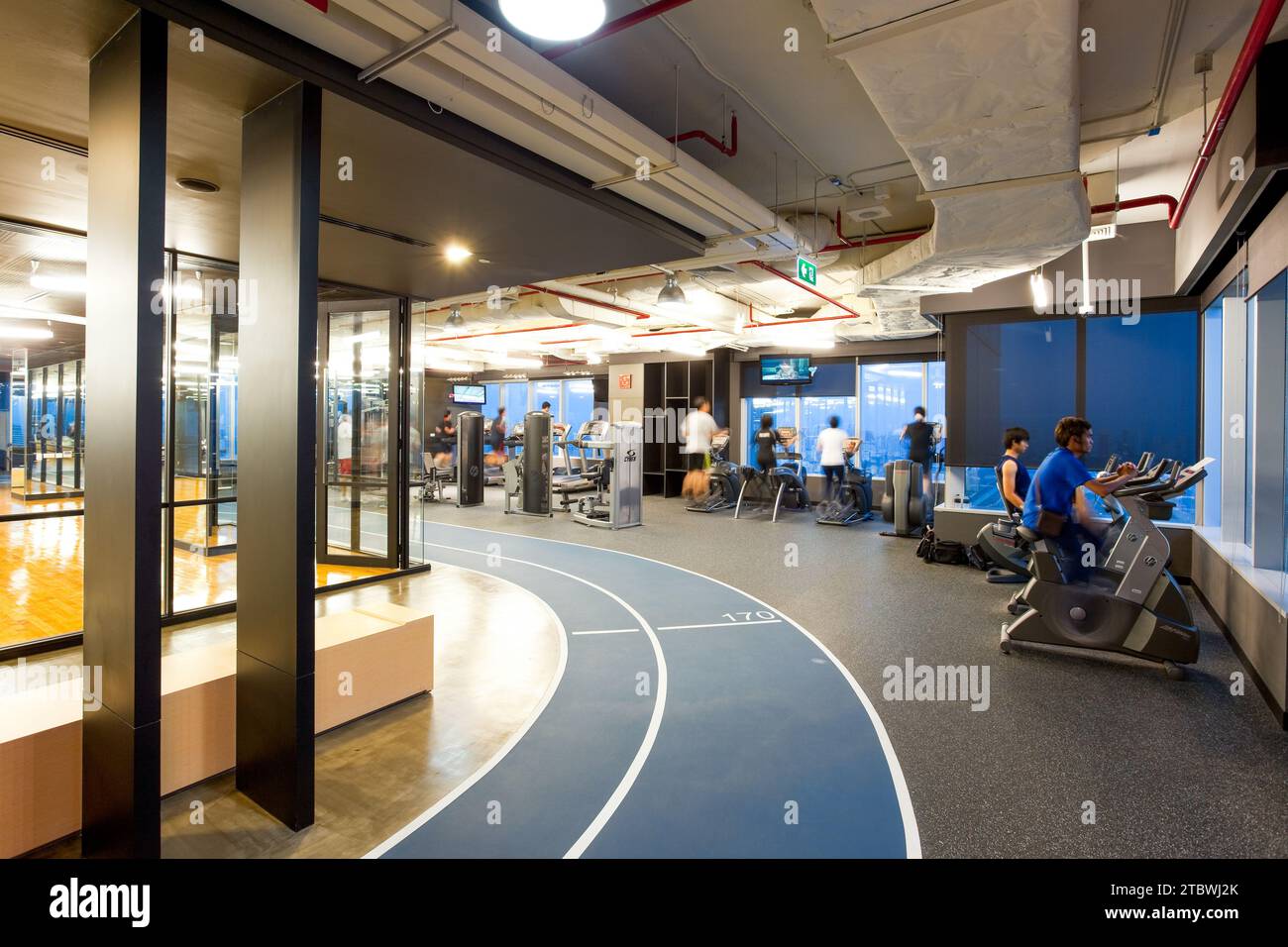 Bangkok, Thailand - March 23, 2010: Indoor gym and fitness center with ...