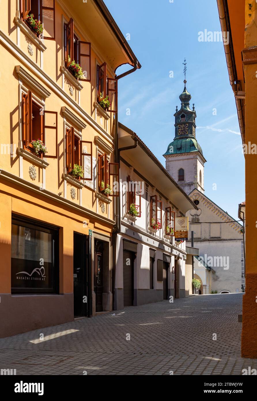 A picture of the St. Jacob Church as seen through nearby alleys Stock ...