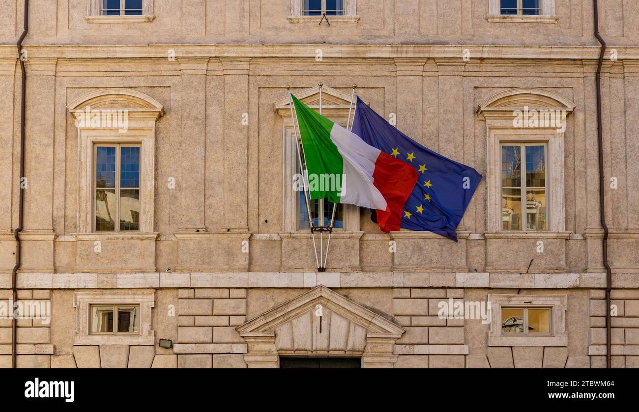 A picture of the Italian and European Union flags on a building facade ...