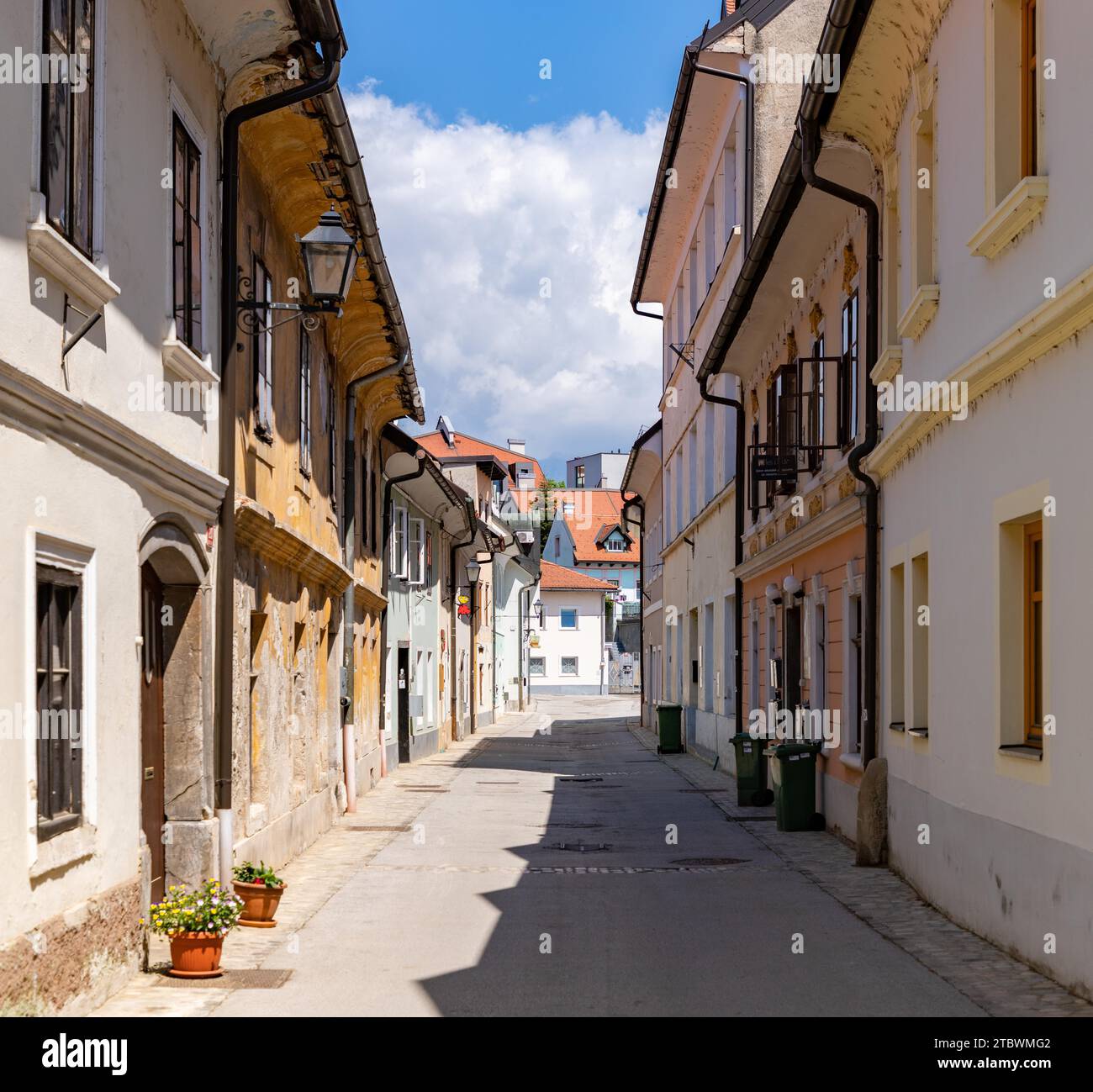 A picture of a narrow and quaint street in Kranj Stock Photo - Alamy