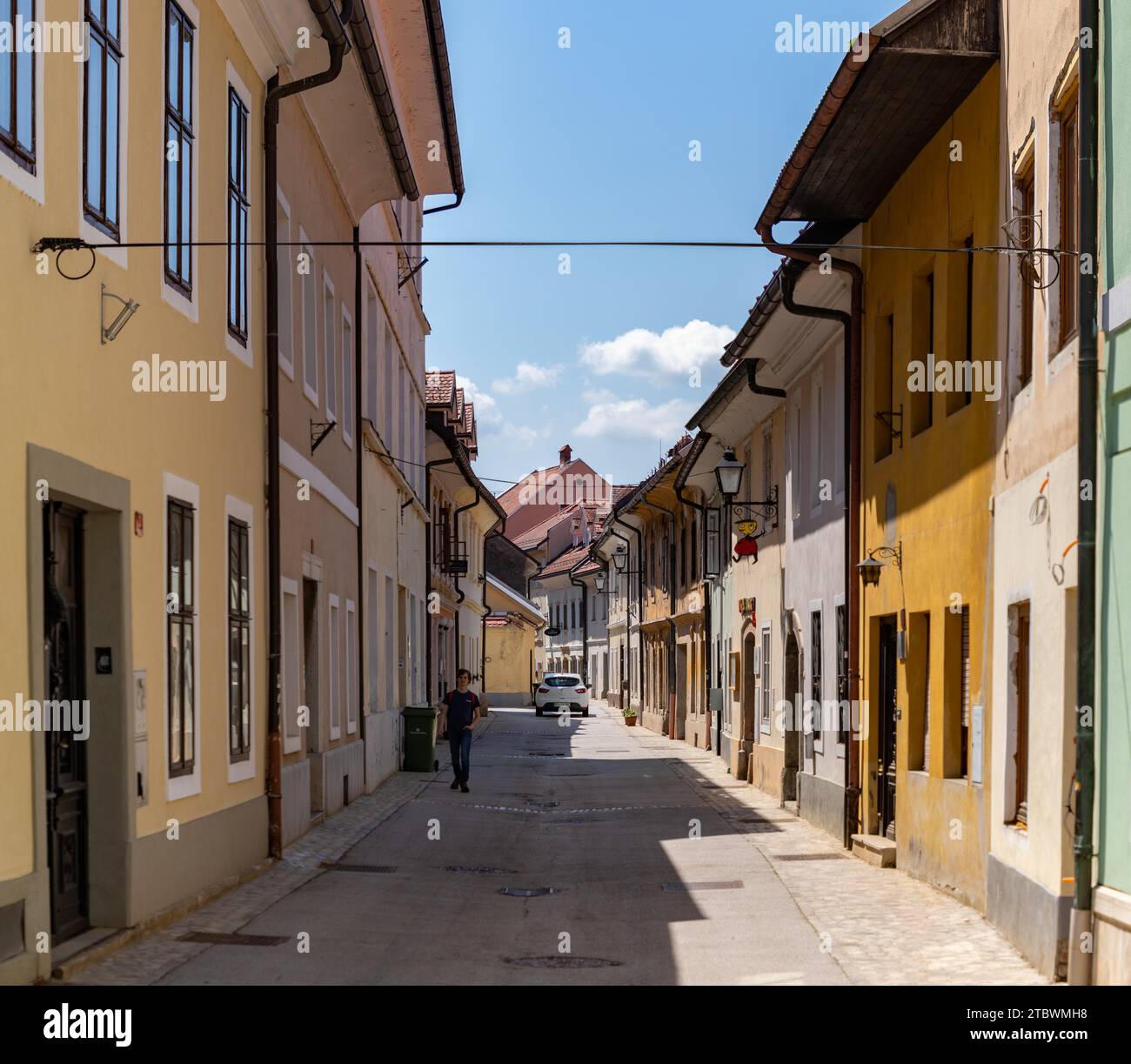A picture of a narrow and quaint street in Kranj Stock Photo - Alamy