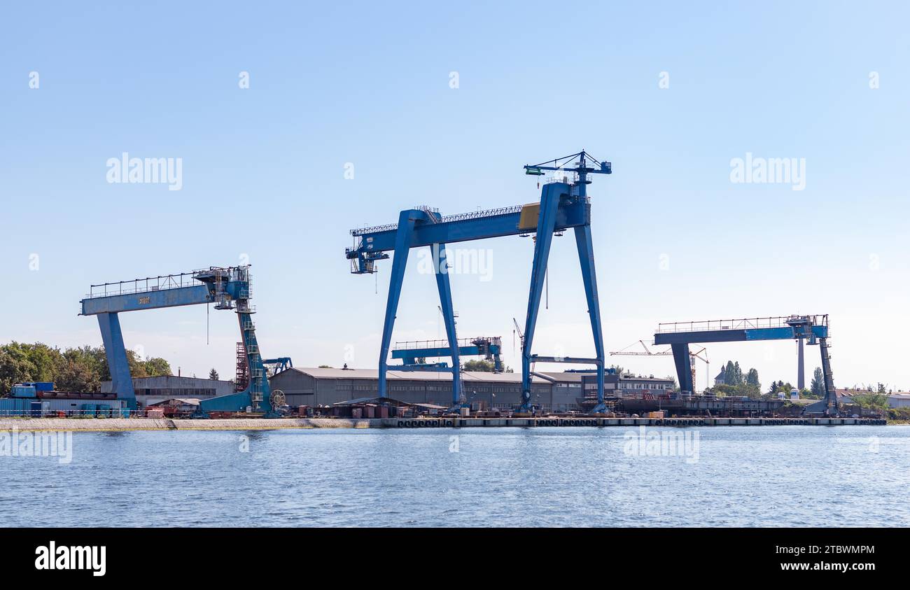 A picture of multiple shipyard cranes in the Gdansk Shipyard Stock ...