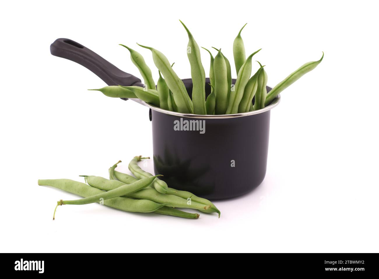 A handful of green beans in the pot isolated on white background ...