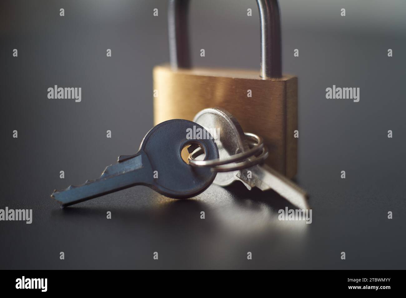 Brass lock, keys playing with light, shadow, reflection and surfaces ...