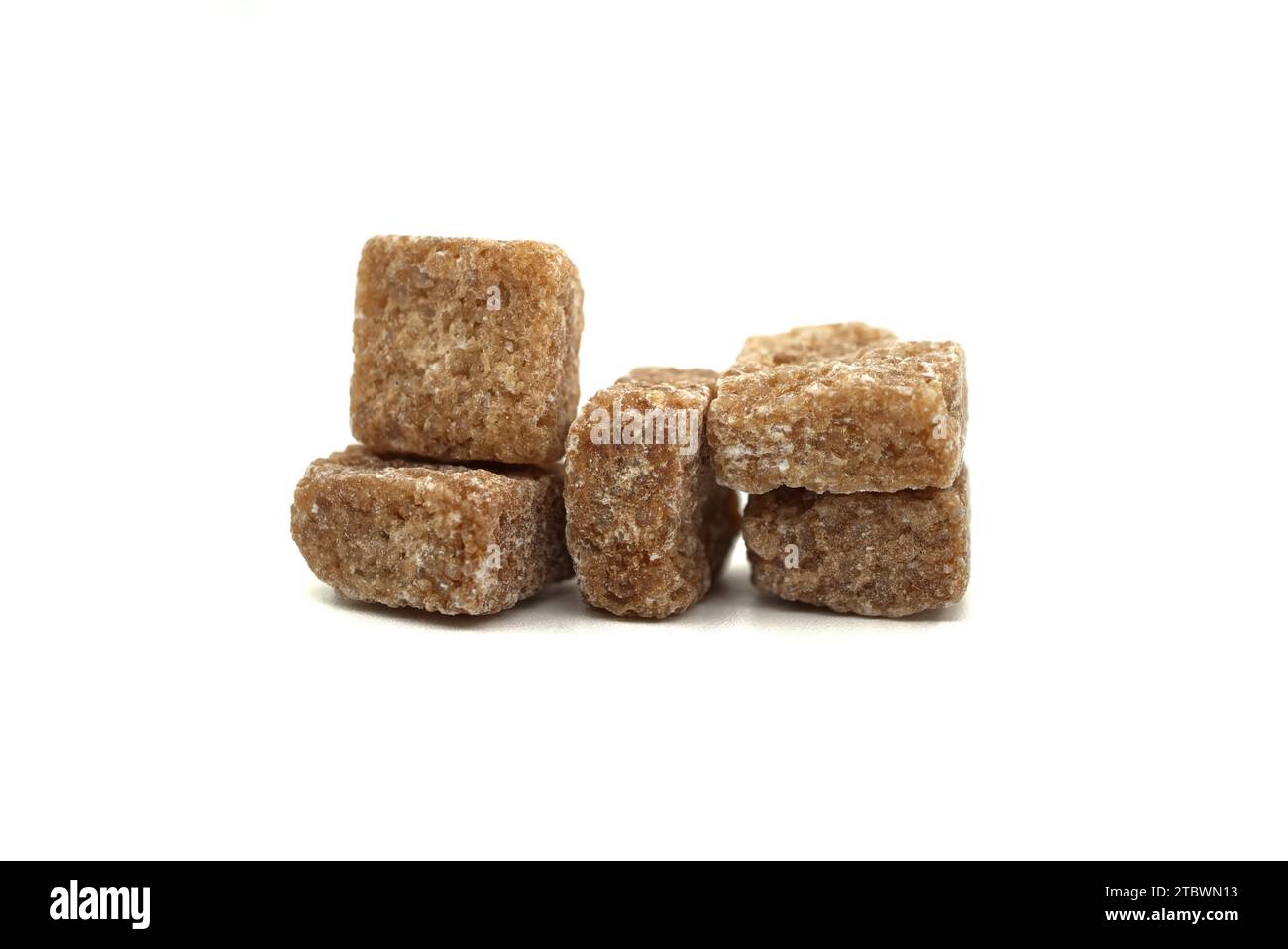 Brown lump sugar isolated on white background Stock Photo - Alamy