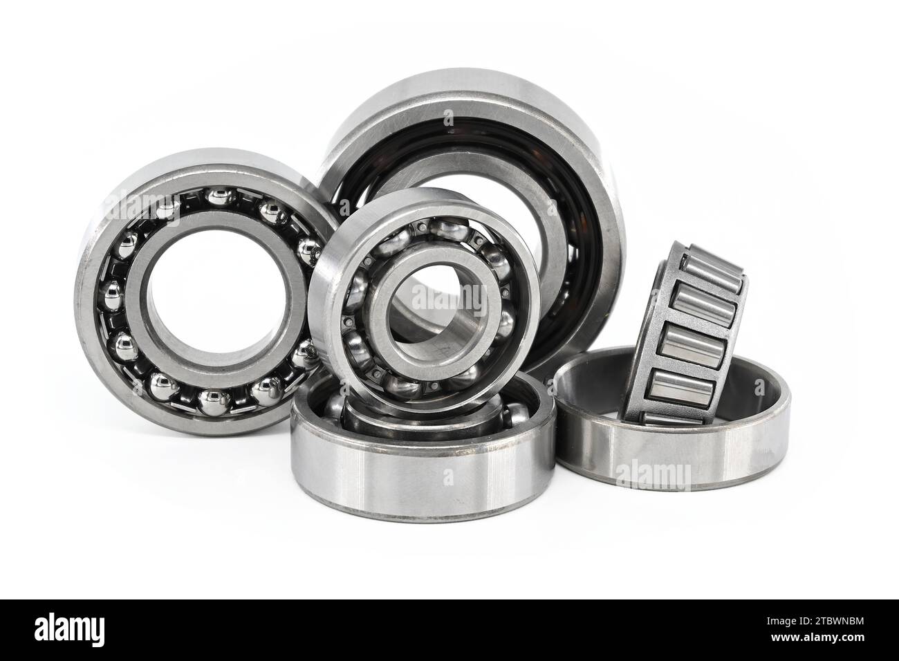 Group of various ball and roller bearings on white background. Spare ...