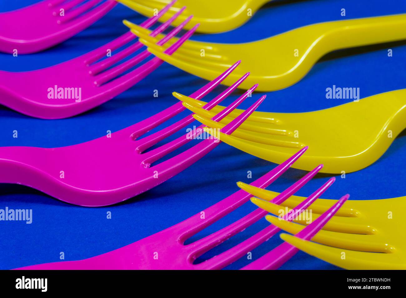 Colorful purple and yellow plastic forks with interlocking prongs ...