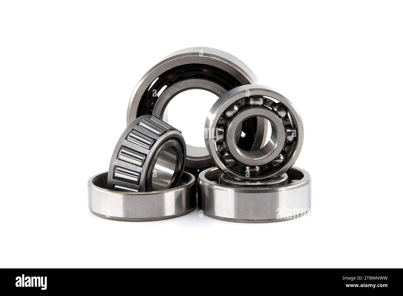 Group of various ball and roller bearings on white background. Spare ...