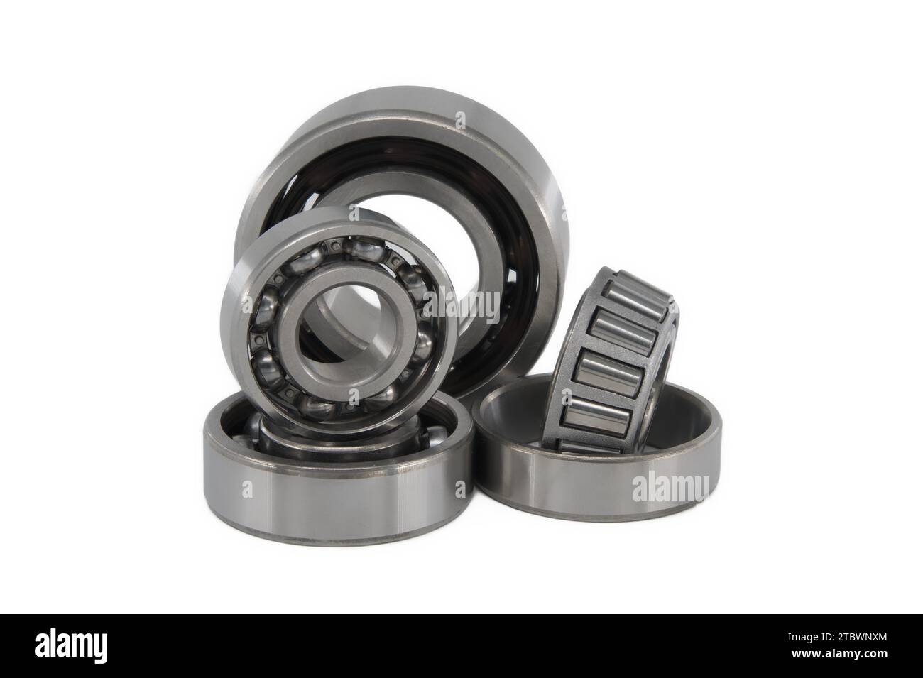 Group of various ball and roller bearings on white background. Spare ...