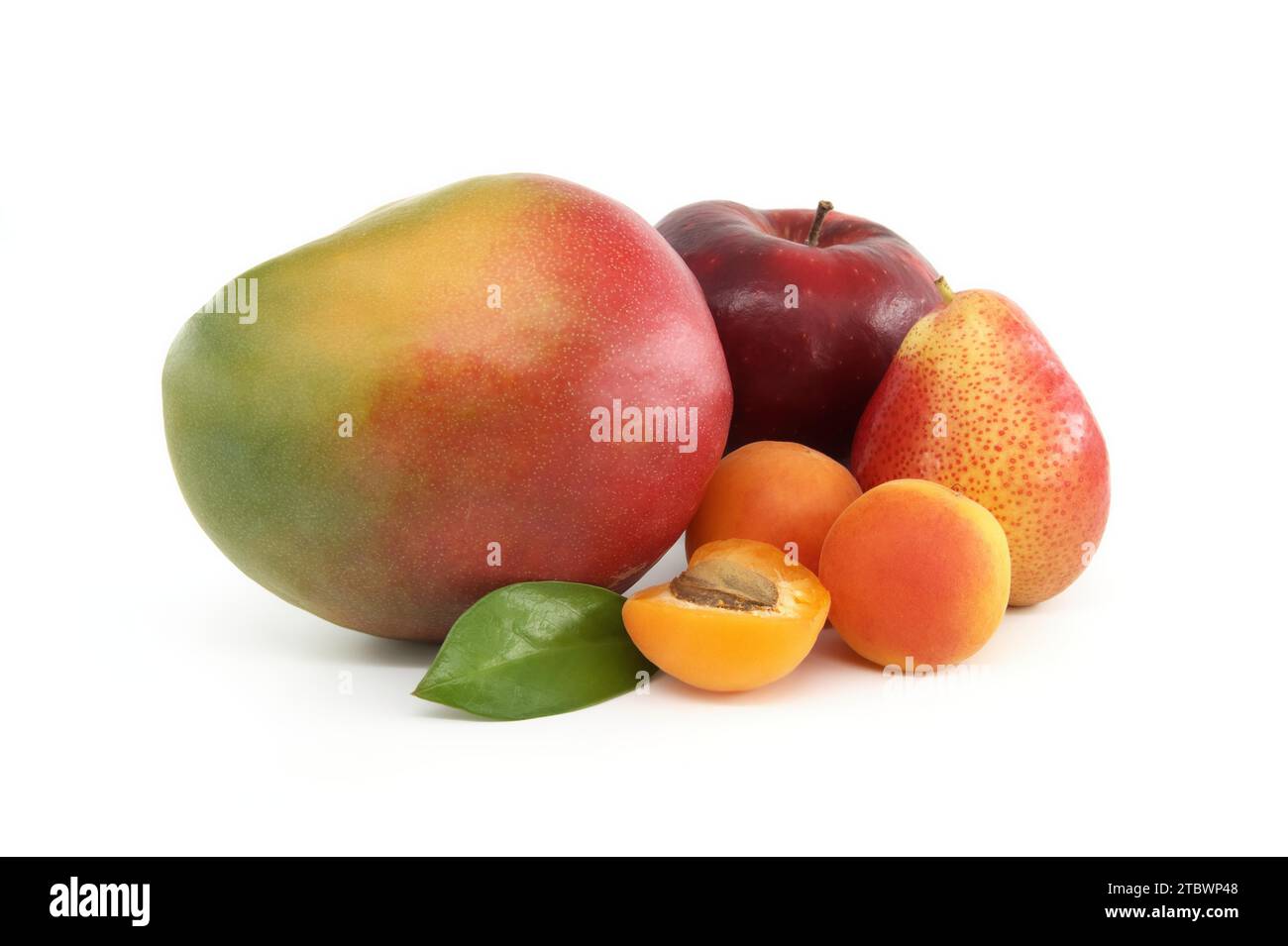 Whole and halved ripe apricot, pear, mango fruit and red apple isolated ...