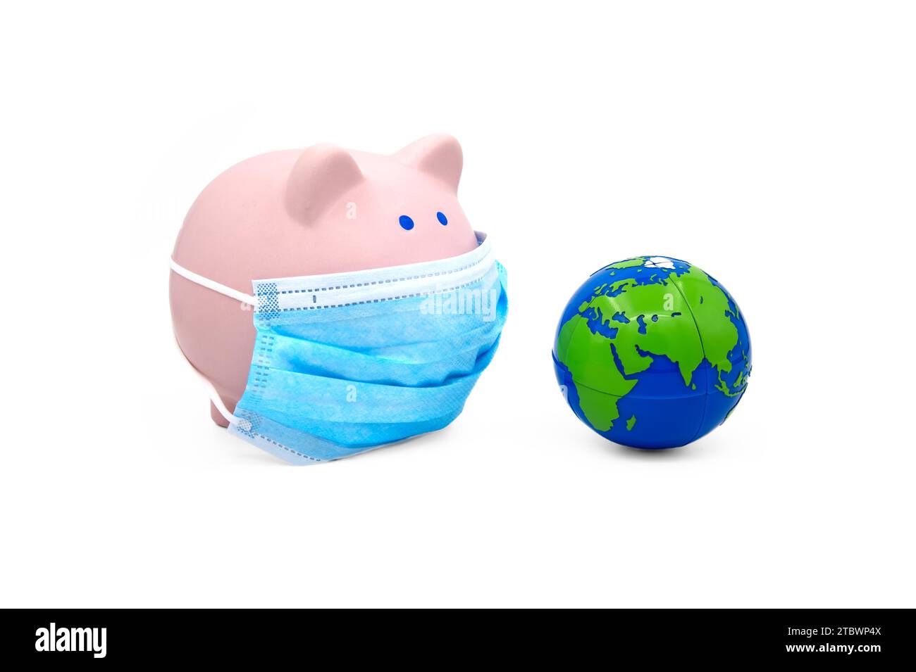 Pink piggy bank with protective medical face mask and earth globe ...