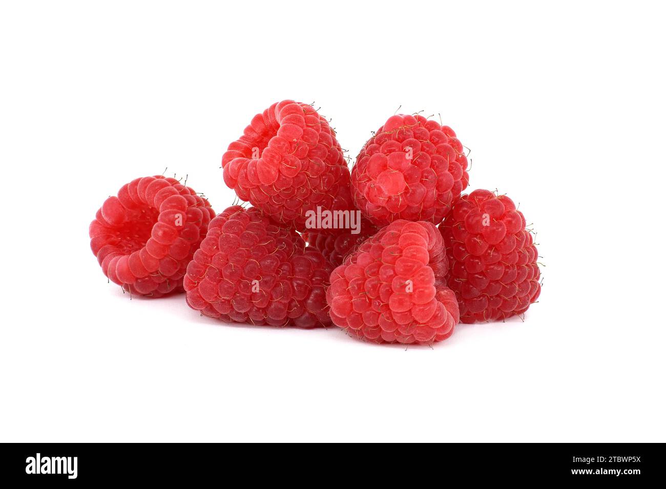 Ripe raspberry fruits with green leaves isolated on white background ...