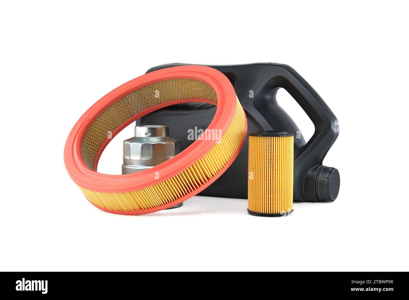 Vehicle engine round air filter, fuel and oil filters near motor oil ...