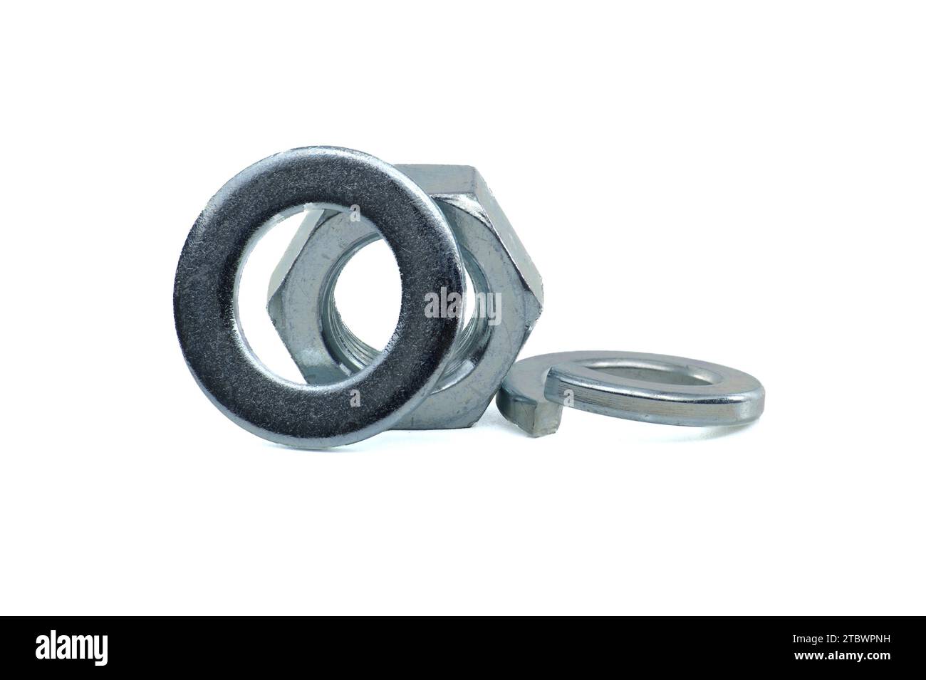 Hexagon nut with flat and spring nut washers isolated on white ...