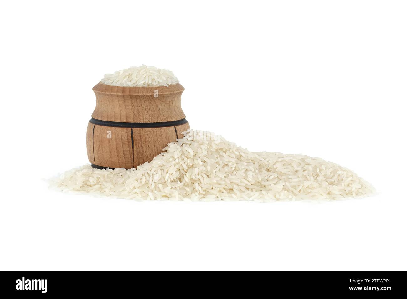 Uncooked long-grain rice in small wooden barrel isolated on white ...