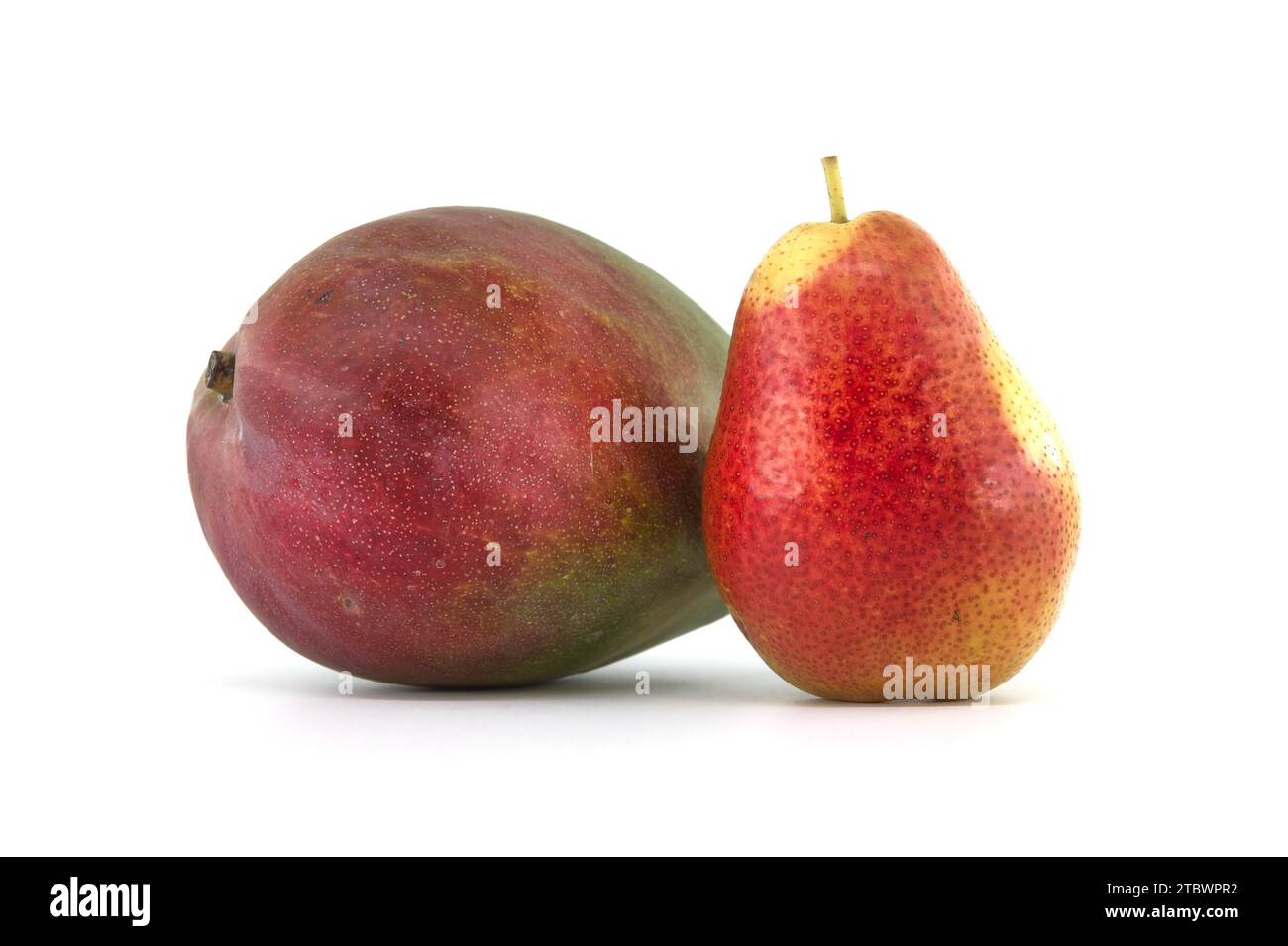 Whole ripe mango and pears isolated on a white background Stock Photo ...