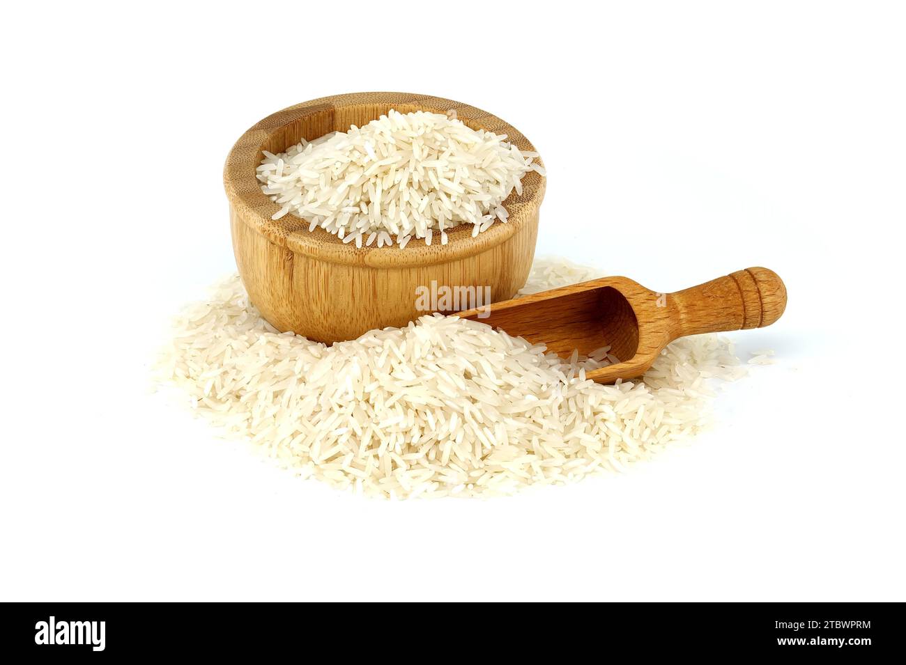 Dry long-grain rice in wooden bowl and wooden scoop isolated on white ...