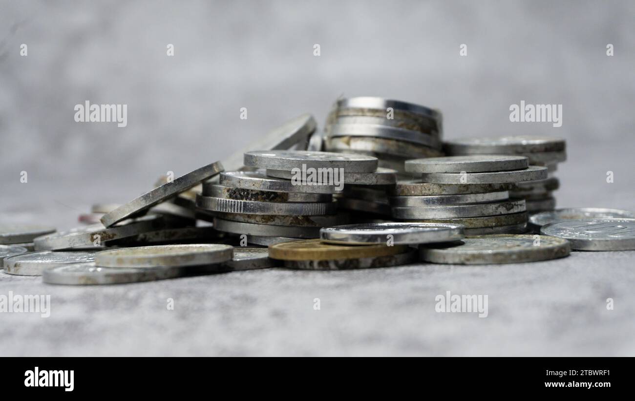 Stack of Indonesian Rupiah currency coins on a gray background with ...