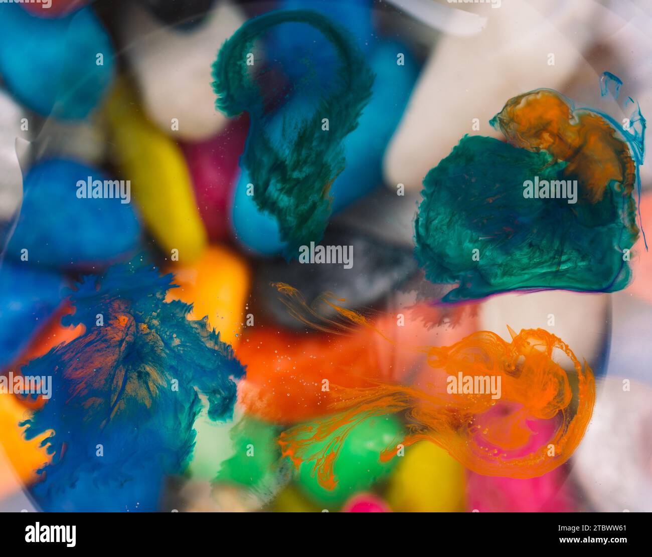 Multi Colorful paint on a surface as an art texture Stock Photo - Alamy