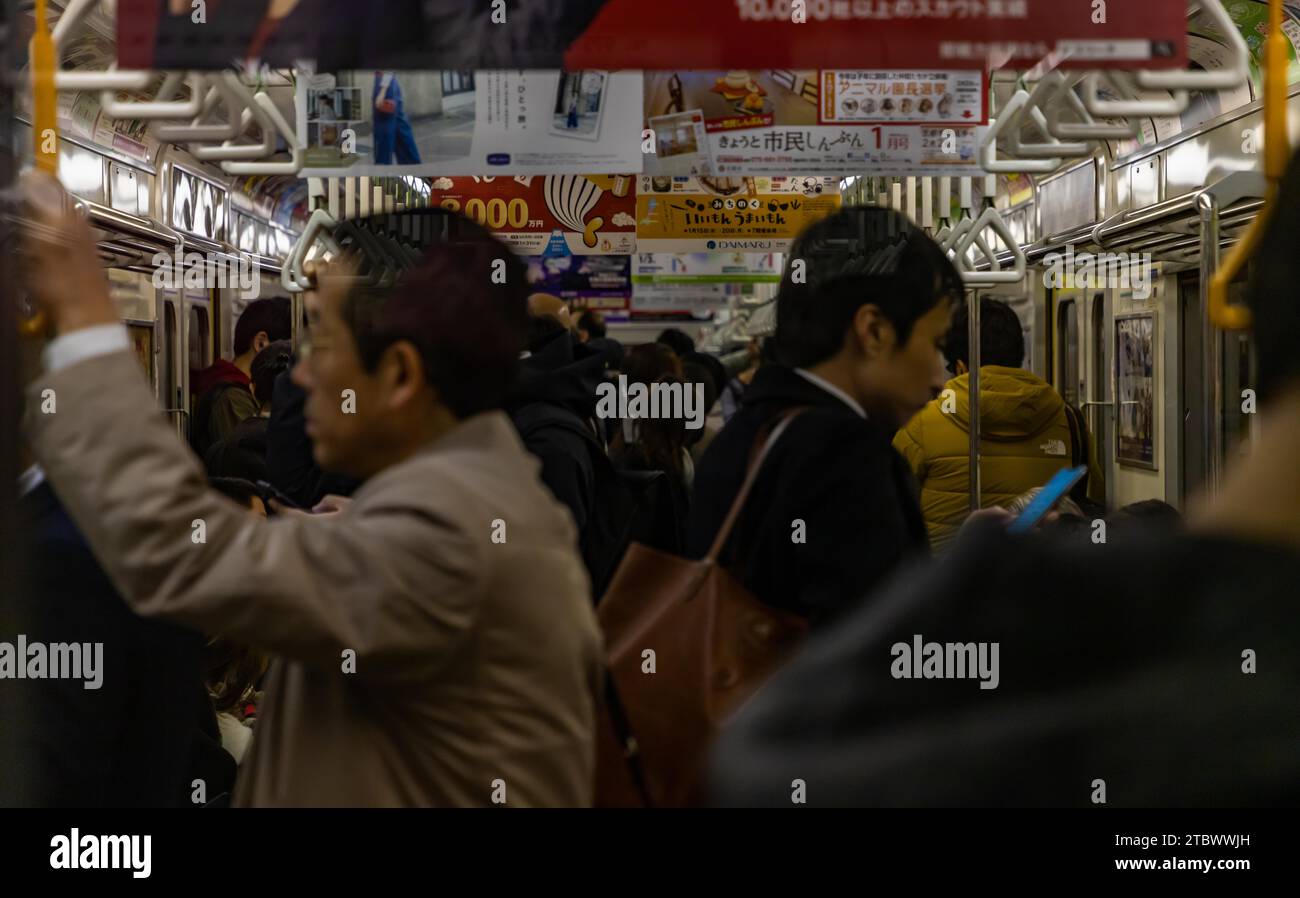 A picture of local commuters riding the subway in Kyoto Stock Photo - Alamy