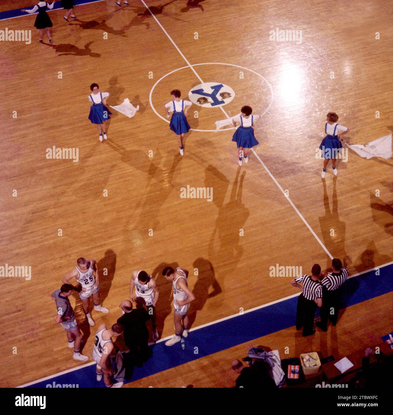 PROVO, UT - JANUARY 12: The BYU Cougars huddle as cheerleaders perform ...