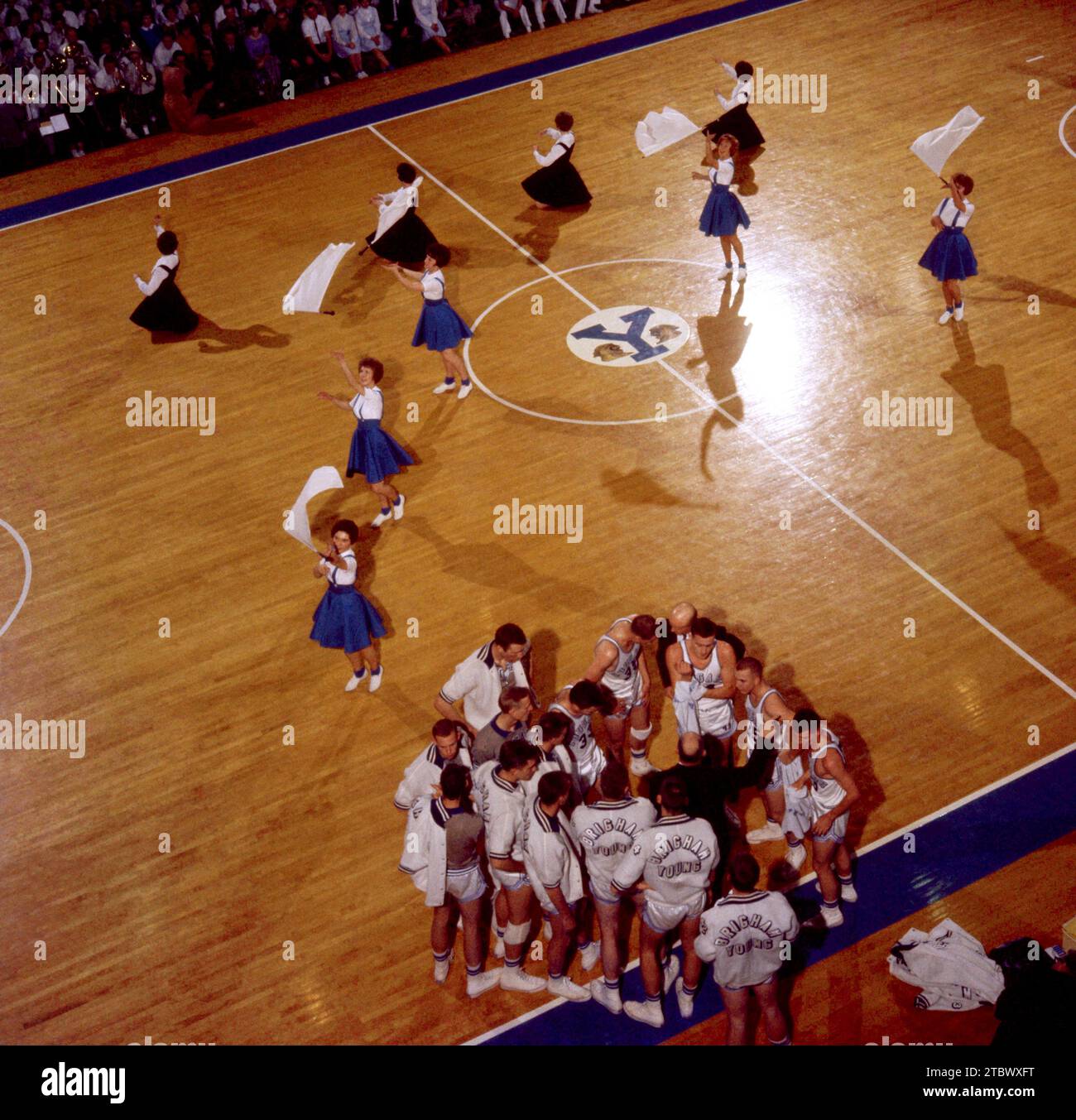 PROVO, UT - JANUARY 12: The BYU Cougars huddle as cheerleaders perform ...