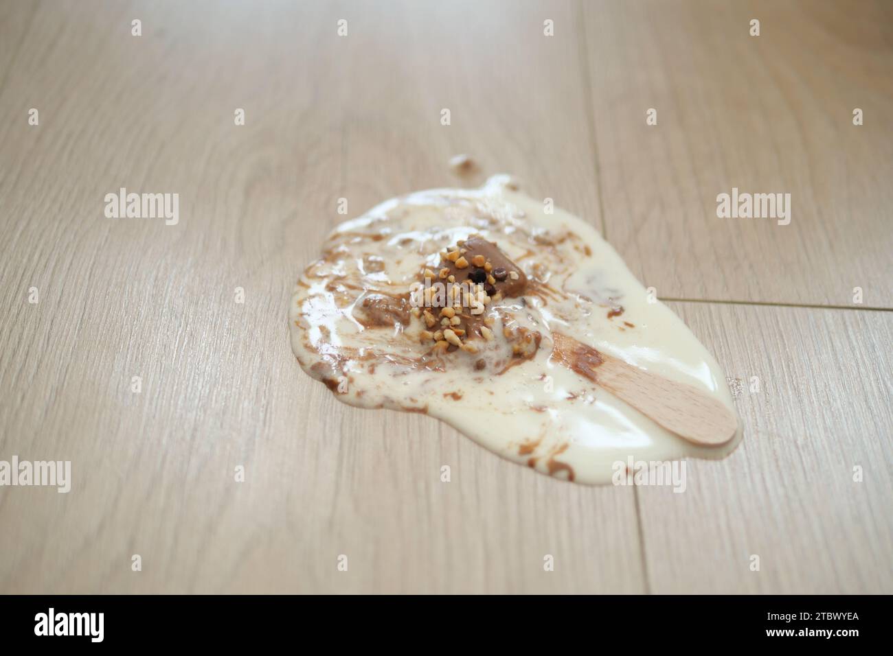 ice cream melting and spilling on floor Stock Photo - Alamy