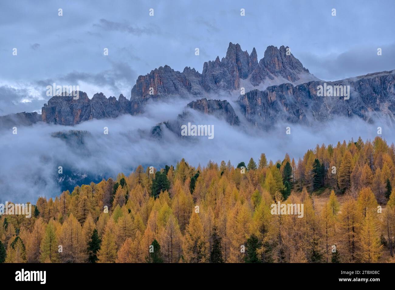 The rock formation Cima Ambrizzola, valleys covered in clouds in autumn ...