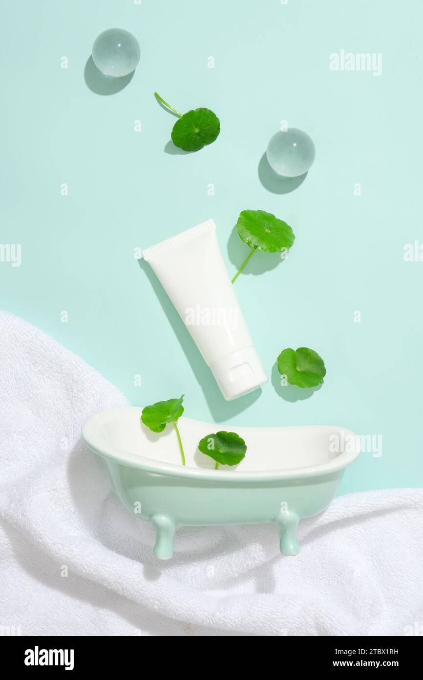 A tube of unlabeled lotion, two glass balls, a mini bathtub and ...