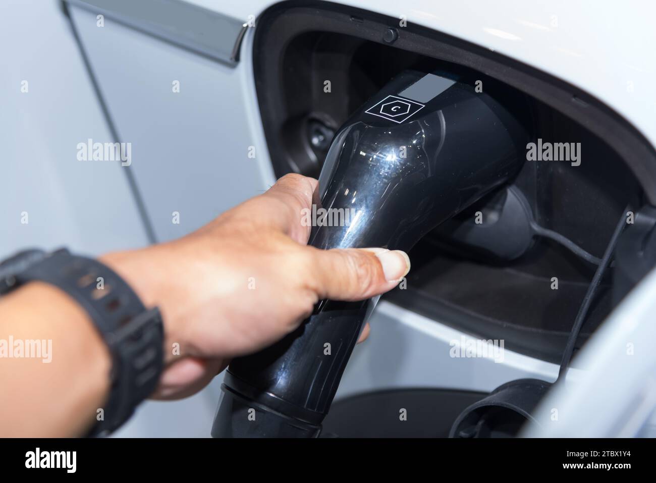 Connect the EV plug for charging the EV car Stock Photo - Alamy