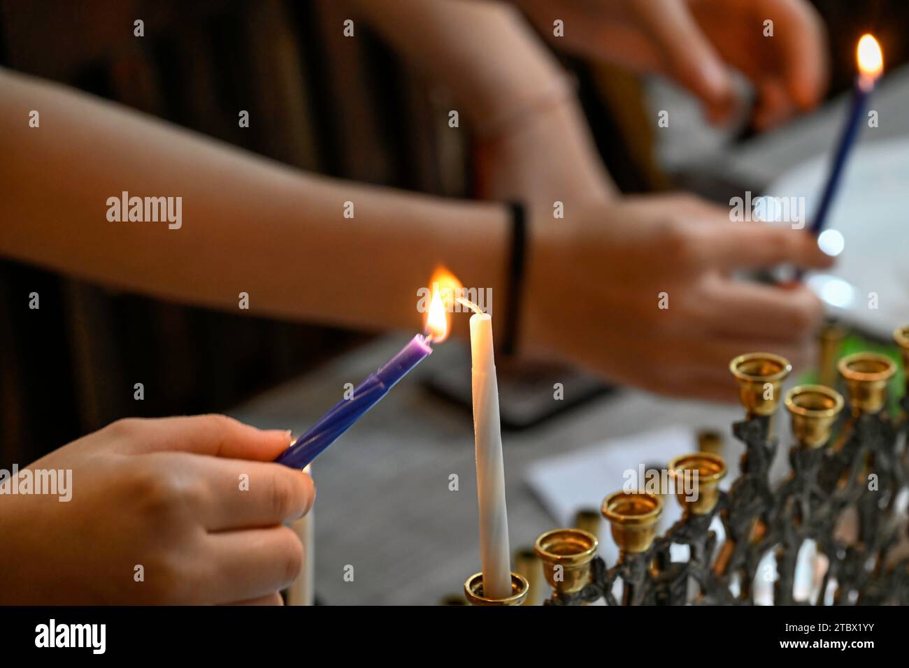Beautiful Hannukah Jewish holiday scene- lighting of the menorah ...