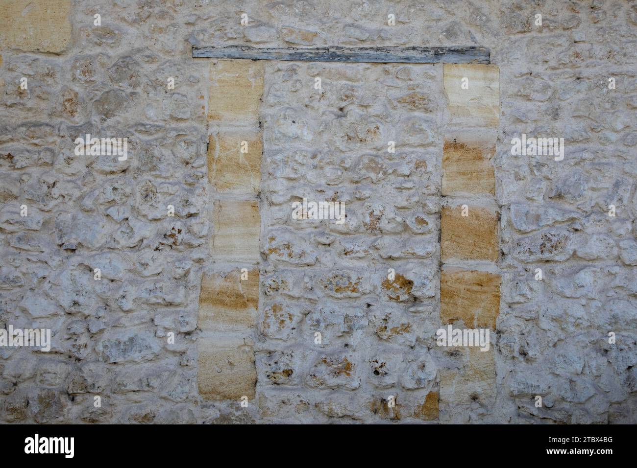 ancient stone wall with a blocked door facade wall high background of ...