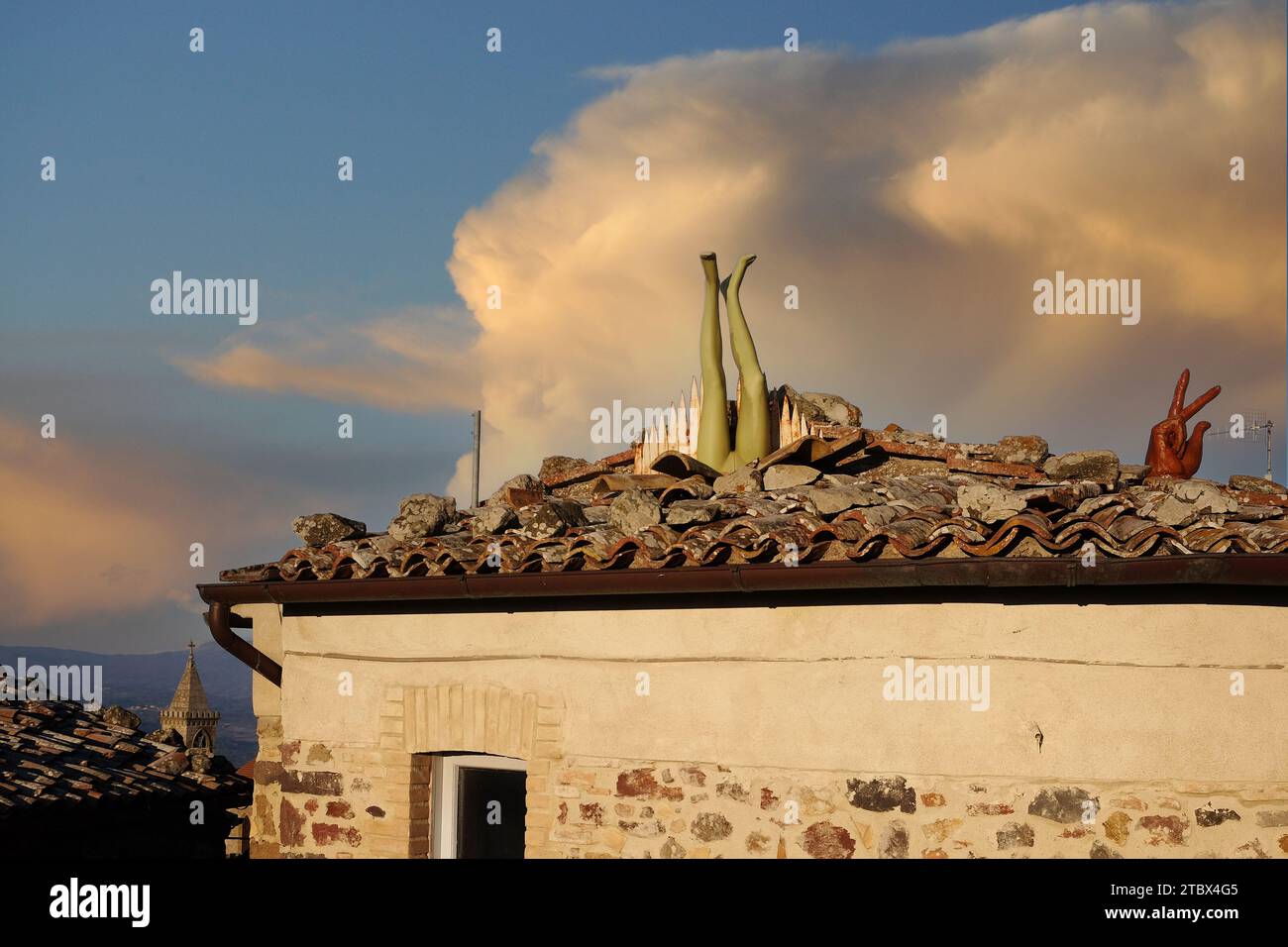 Funny sculptures on the roofs of village of Torre Alfina, Italy Stock ...