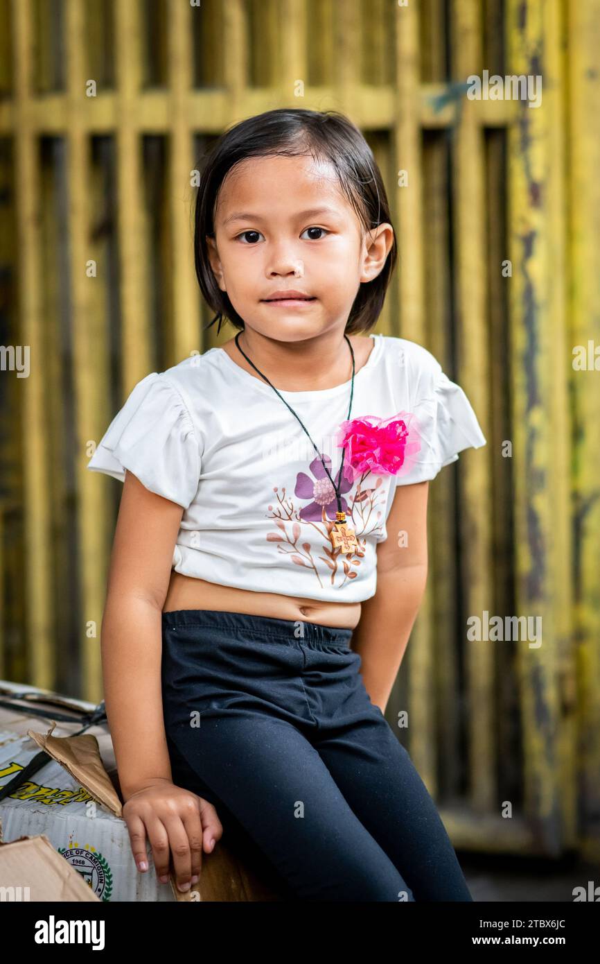 A pretty young Filipino girl poses for the camera in Ermita, Manila ...