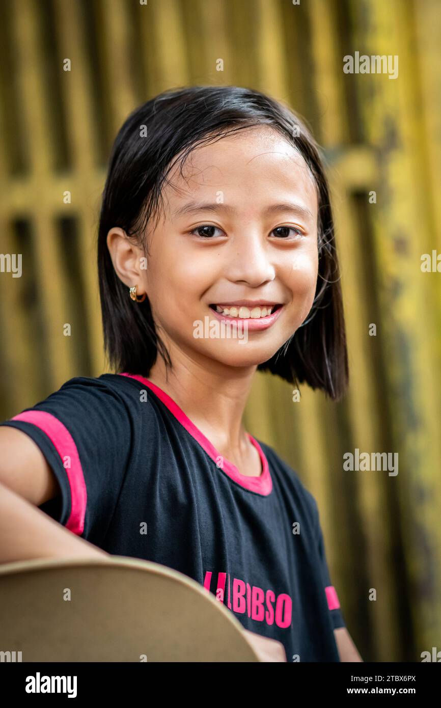 A pretty young Filipino girl poses for the camera in Ermita, Manila ...