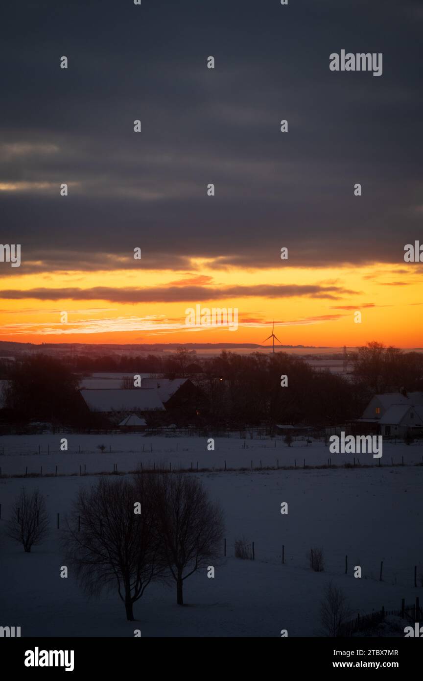 Rural landscape with wind turbine on cold winter morning with sunrise ...