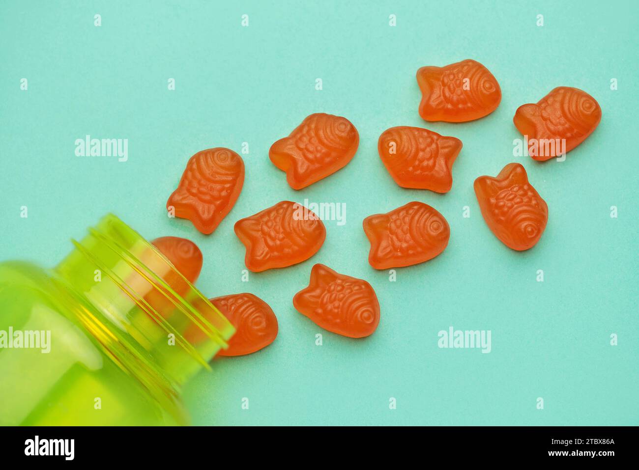 Vitamins for children, jelly gummy fesh candy on pastel green ...