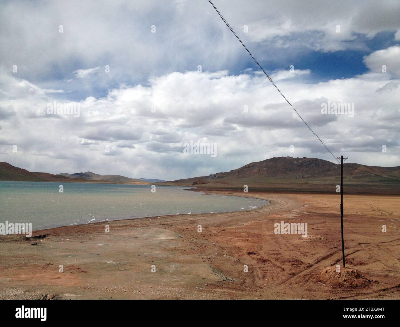 A tranquil and serene landscape featuring an arid desert terrain, with ...