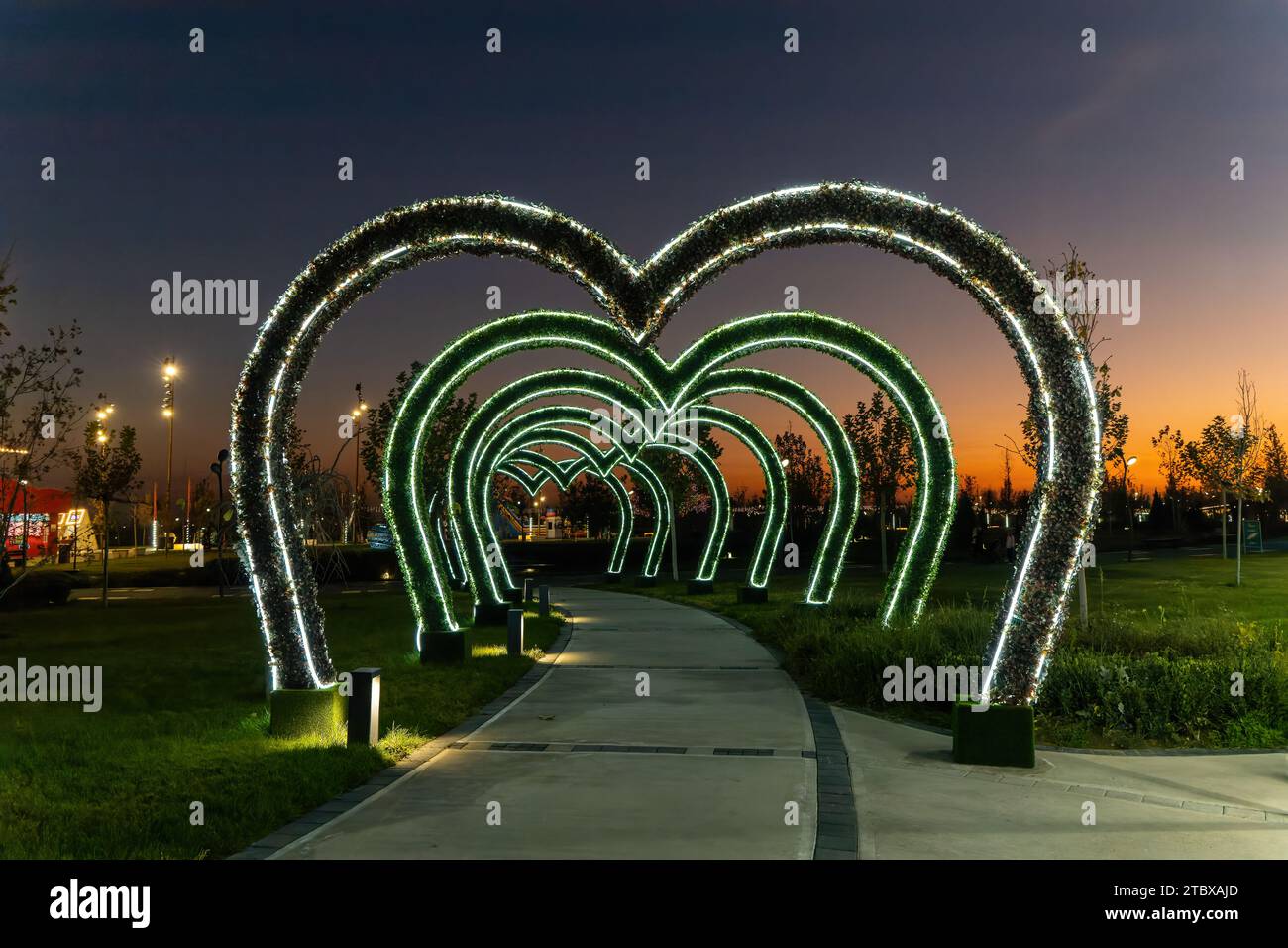 Evening festive path decorated with bright lanterns Stock Photo - Alamy