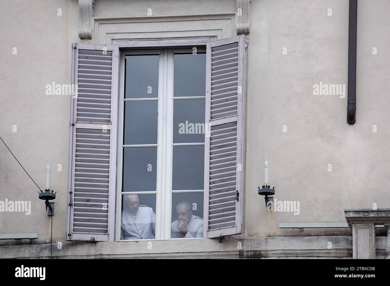 Rome, Italy, 8 December 2023. Waiters peak from a window of the Spanish ...