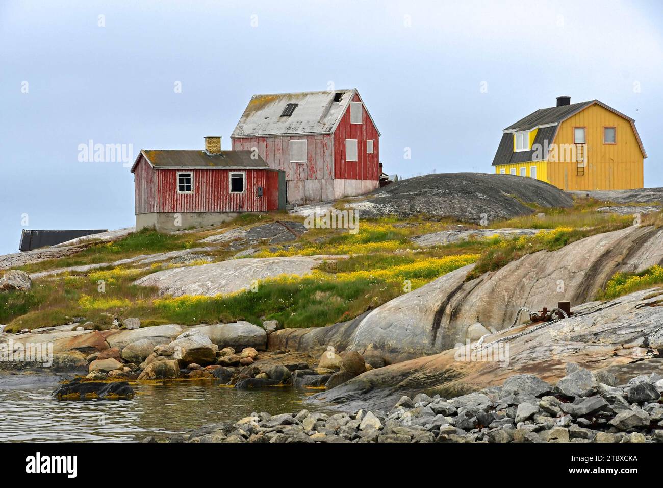 colorful houses on the rocky shore of the remote fishing village of ...