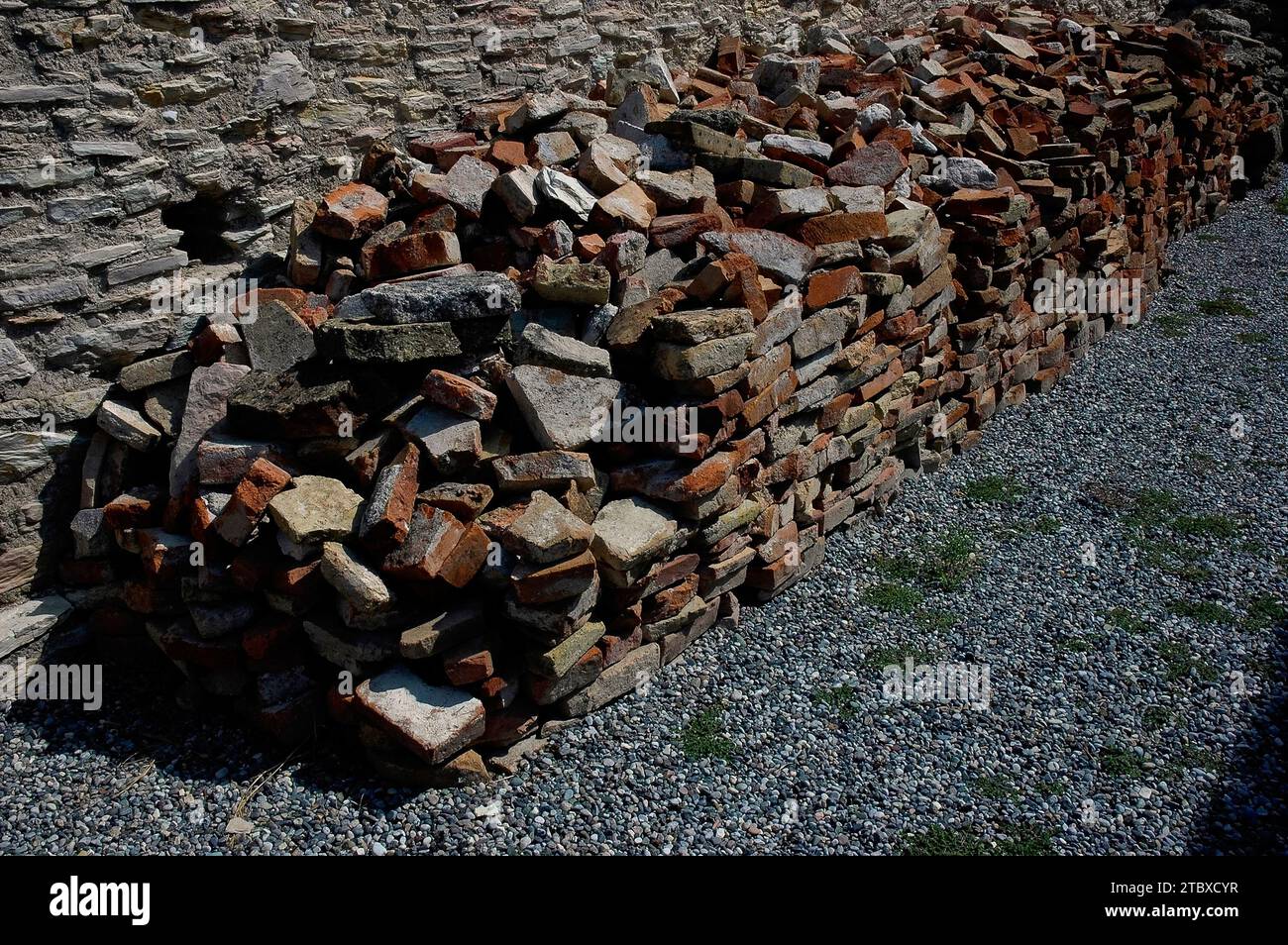 Stack of Roman bricks piled up for restoration work amid the ruins of ...