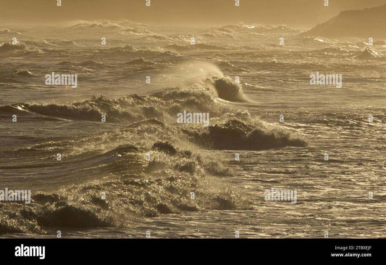 Waves stirred up by a winter storm break along the North Sea coast. The ...